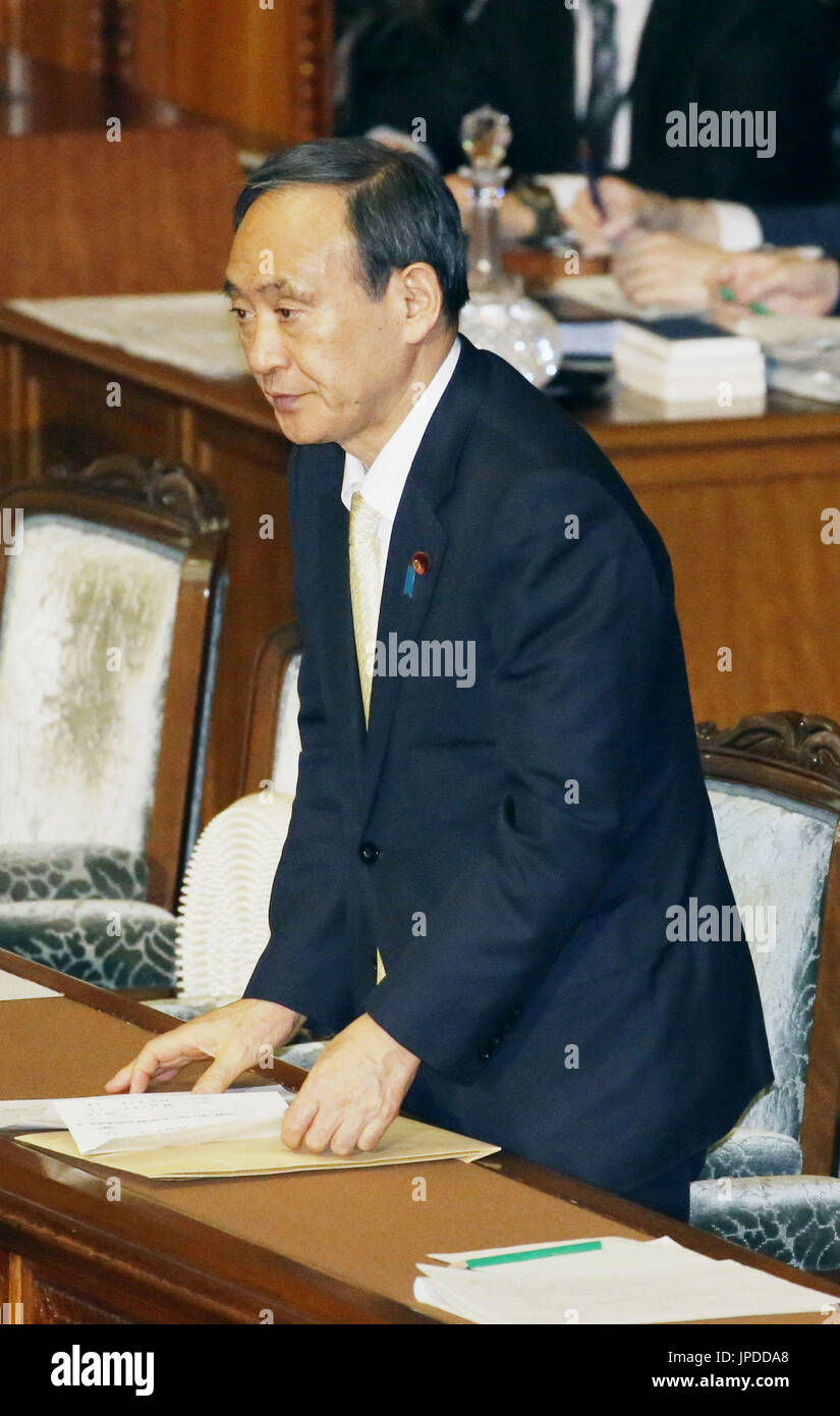 Chief Cabinet Secretary Yoshihide Suga bows in appreciation at a House ...