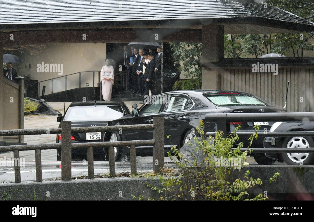 Japanese Prime Minister Shinzo Abe's motorcade arrive at a hot spring ...
