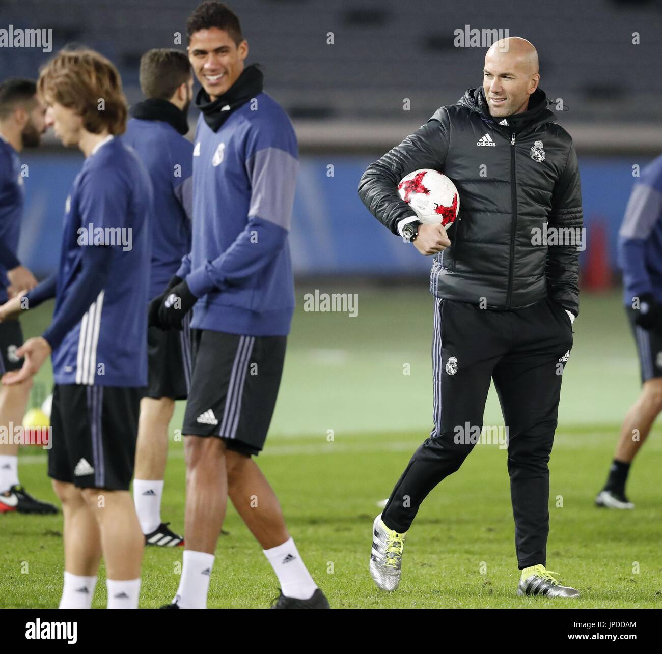 Real Madrid coach Zinedine Zidane (far R) takes charge of a training ...