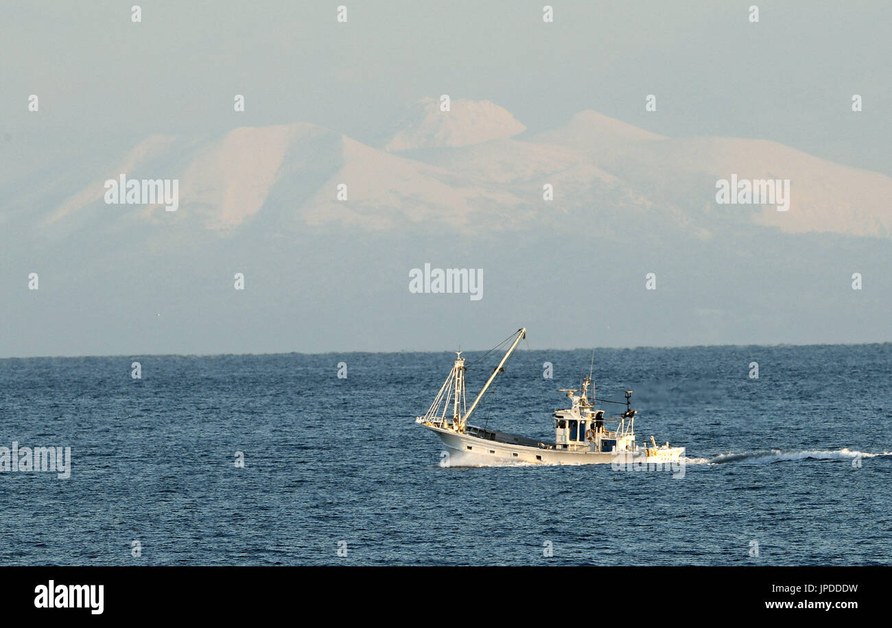 A fishing boat sails off Cape Nosappu in Nemuro on Japan's northernmost ...