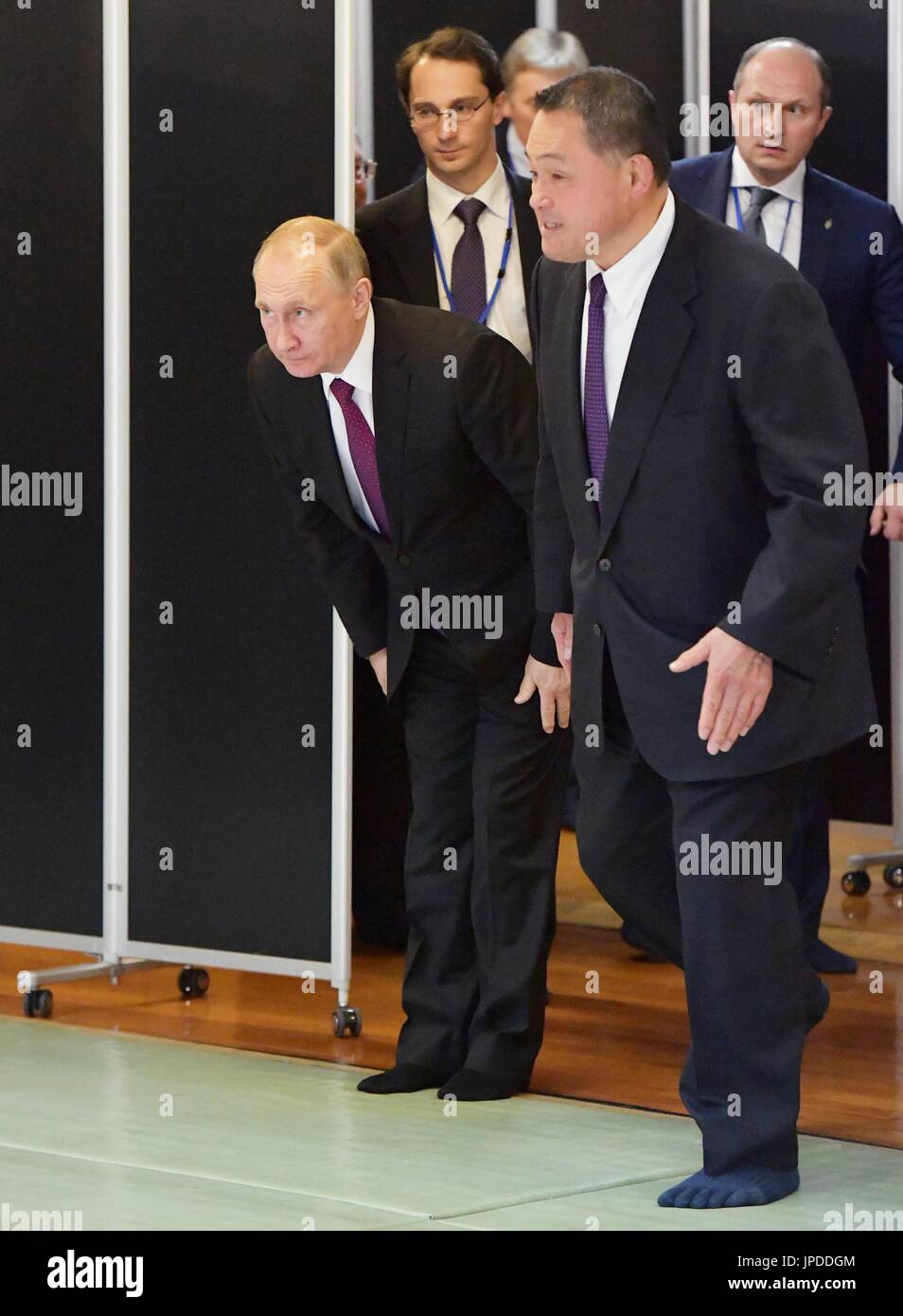 Russian President Vladimir Putin (L), a well-known judo enthusiast ...