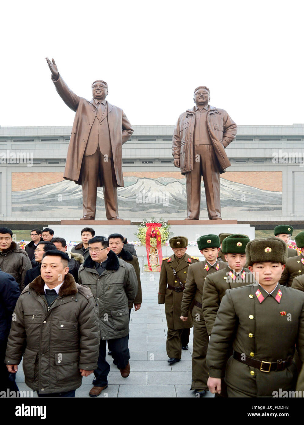 North Korean people visit bronze statues of former leaders Kim Il Sung ...