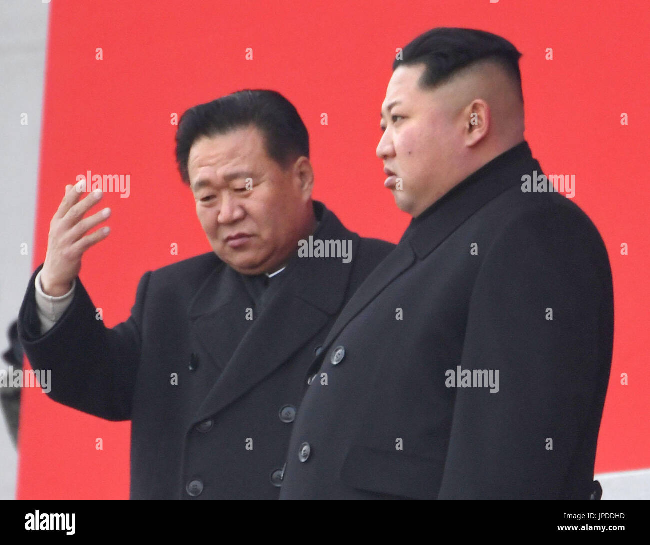 North Korean leader Kim Jong Un (R) attends a memorial service ...