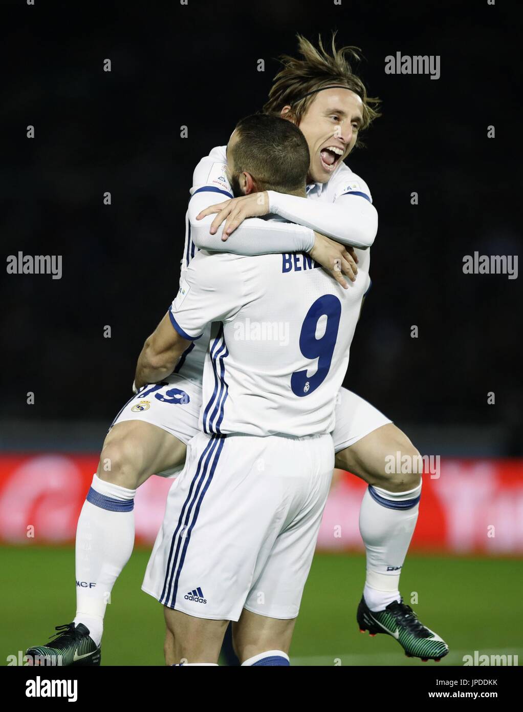 Luka Modric of Spain's Real Madrid hugs teammate Karim Benzema (9 ...