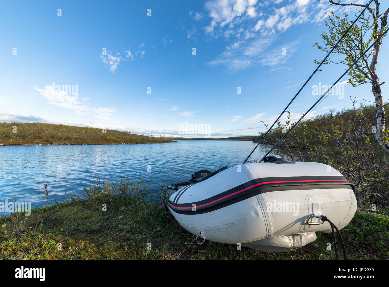 white inflatable boat lake mountain Stock Photo - Alamy