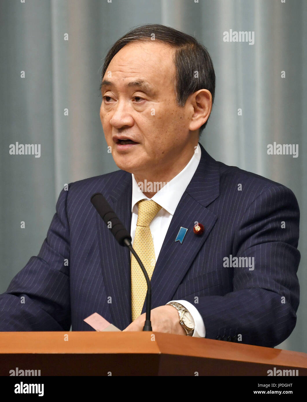 Japanese Chief Cabinet Secretary Yoshihide Suga attends a press ...