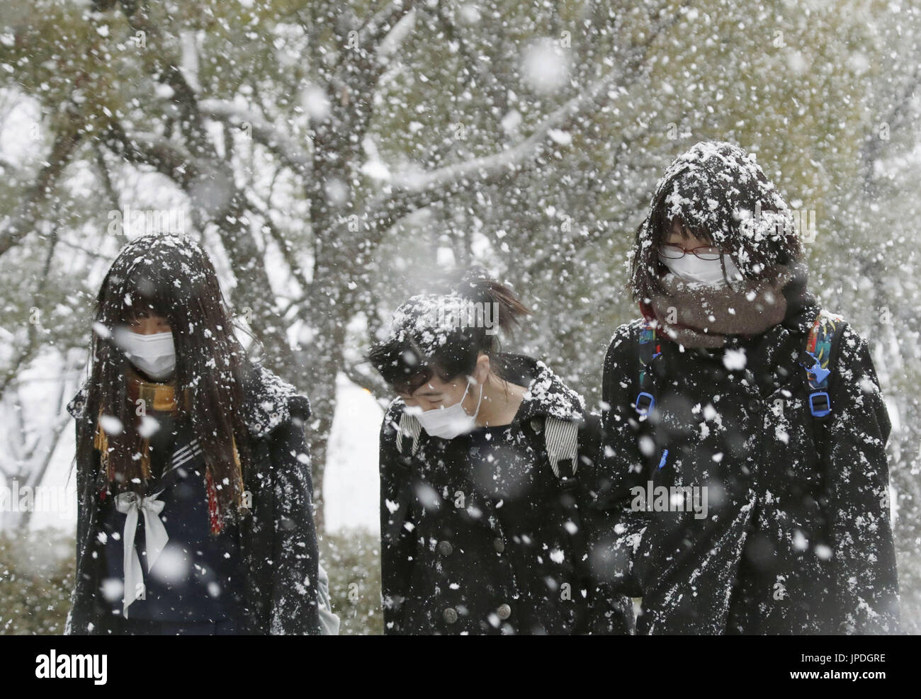 High school students walk in heavy snow in Nagoya in central Japan to ...