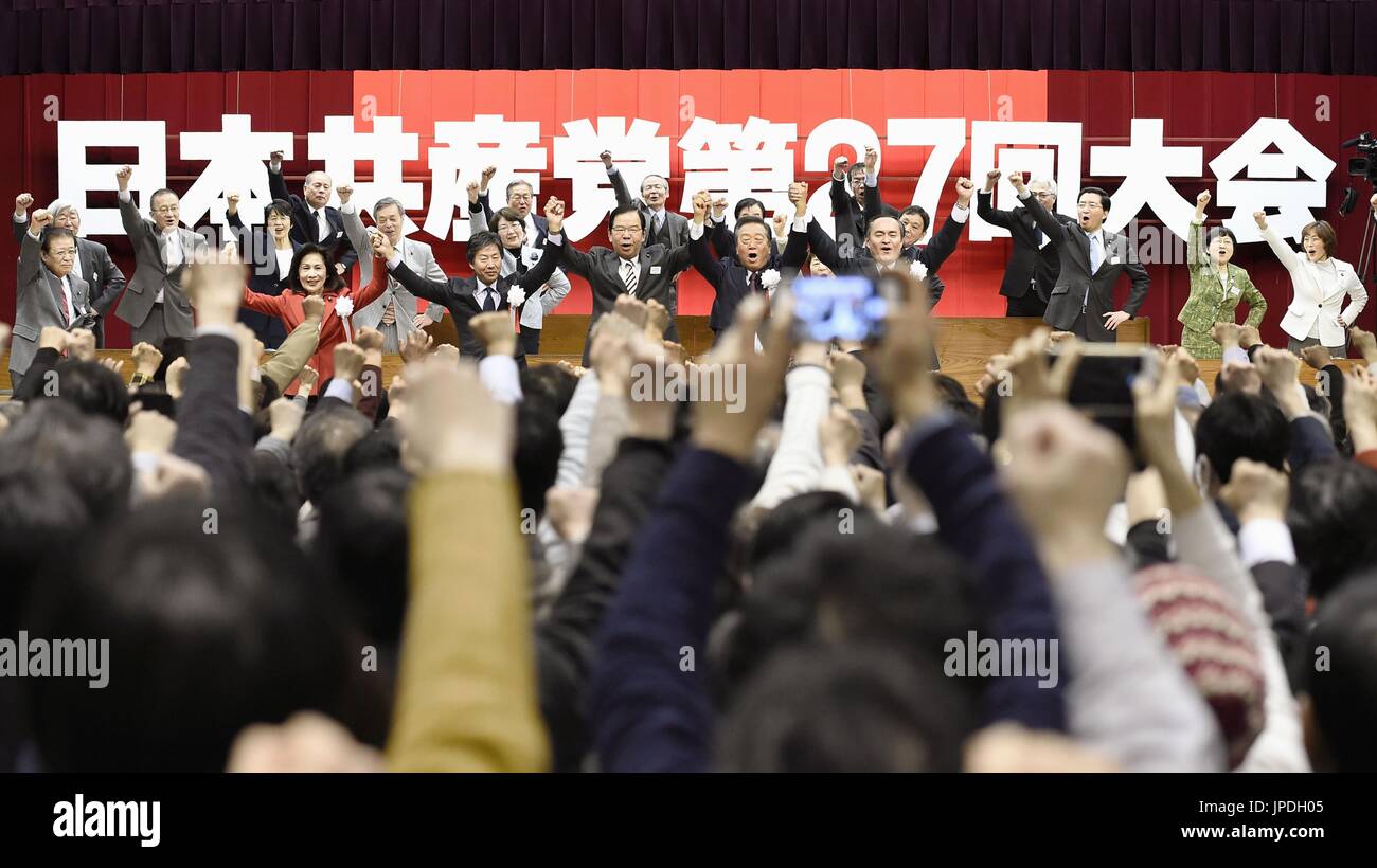 Japanese Communist Party leader Kazuo Shii (C) appears on stage on Jan ...
