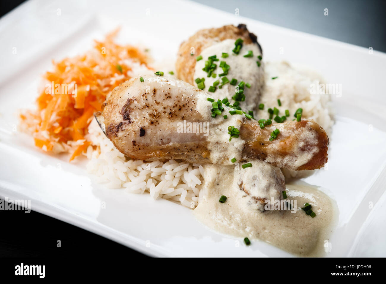 Chicken legs with rice Stock Photo - Alamy