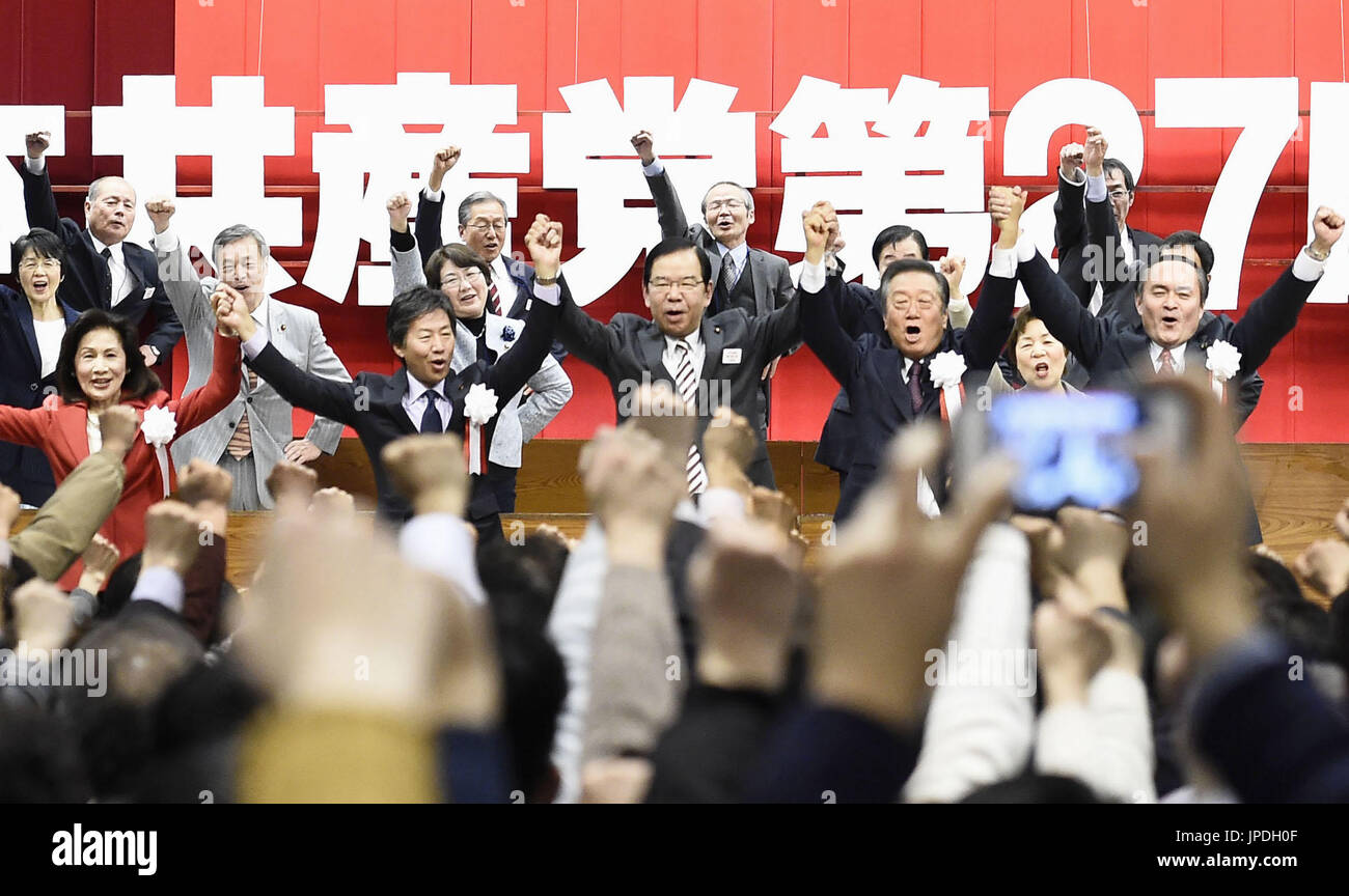 Japanese Communist Party leader Kazuo Shii (C) appears on stage on Jan ...