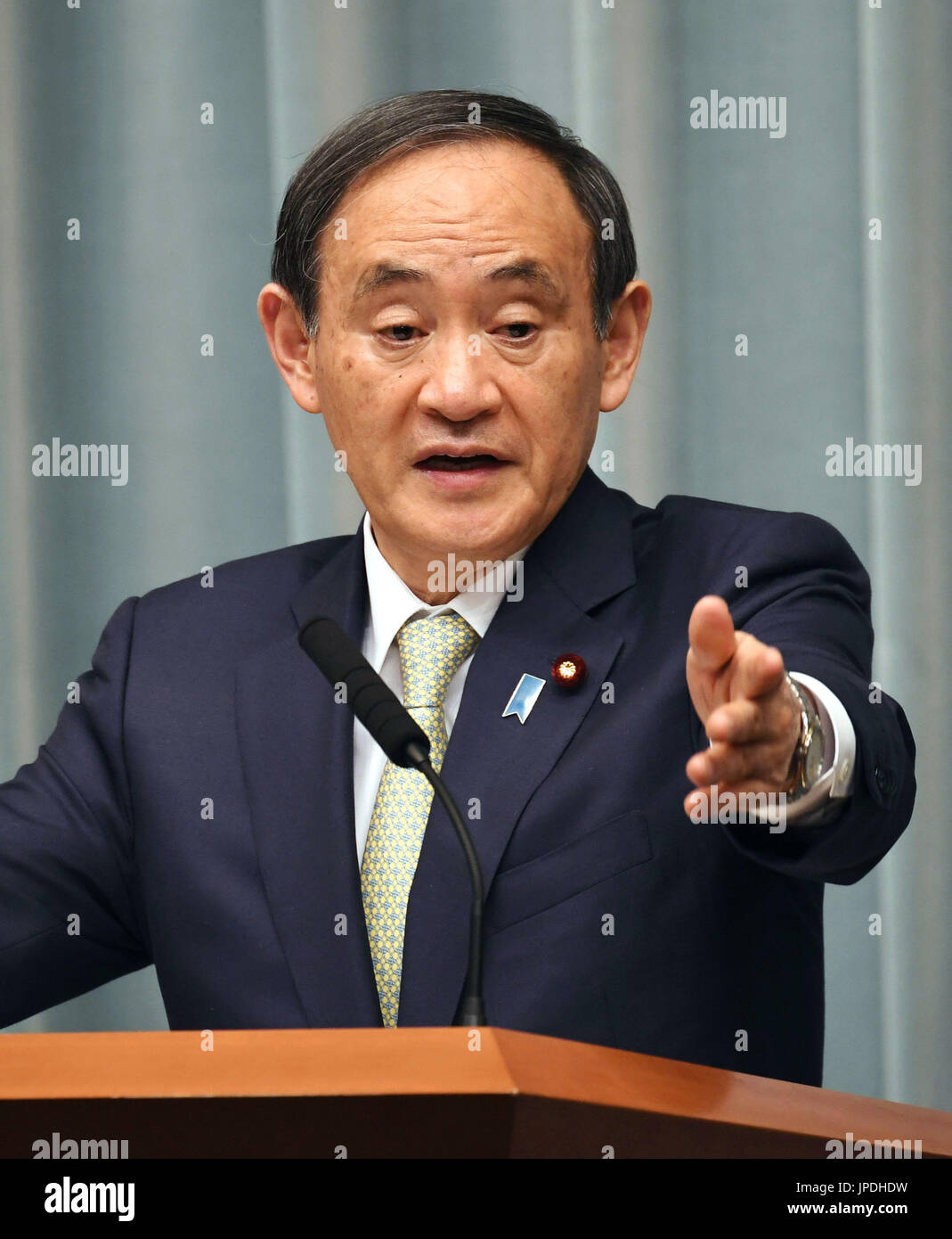 Japanese Chief Cabinet Secretary Yoshihide Suga attends a press ...