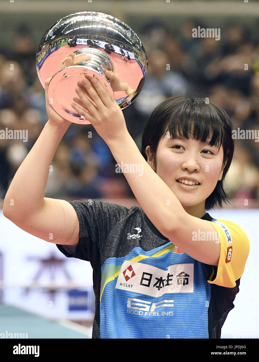 Miu Hirano holds up the Empress Cup after winning the women's singles ...