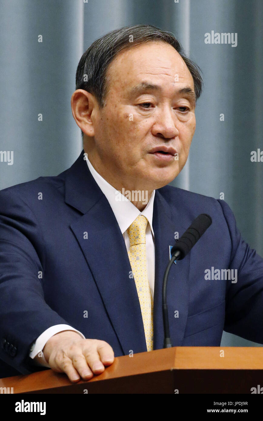 Japanese Chief Cabinet Secretary Yoshihide Suga attends a press ...