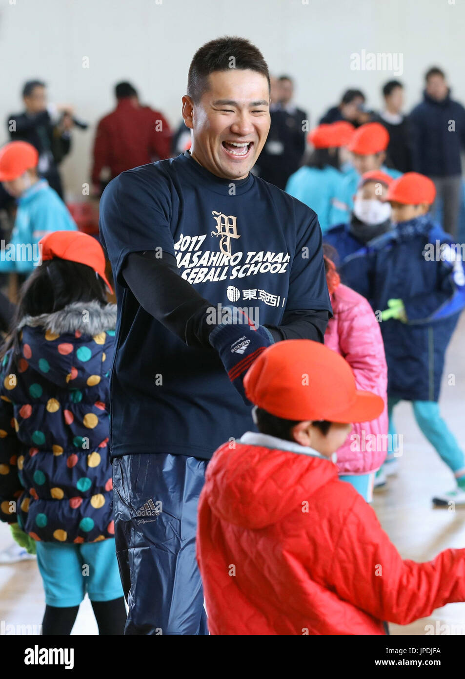 New York Yankees pitcher Masahiro Tanaka plays with school children at ...