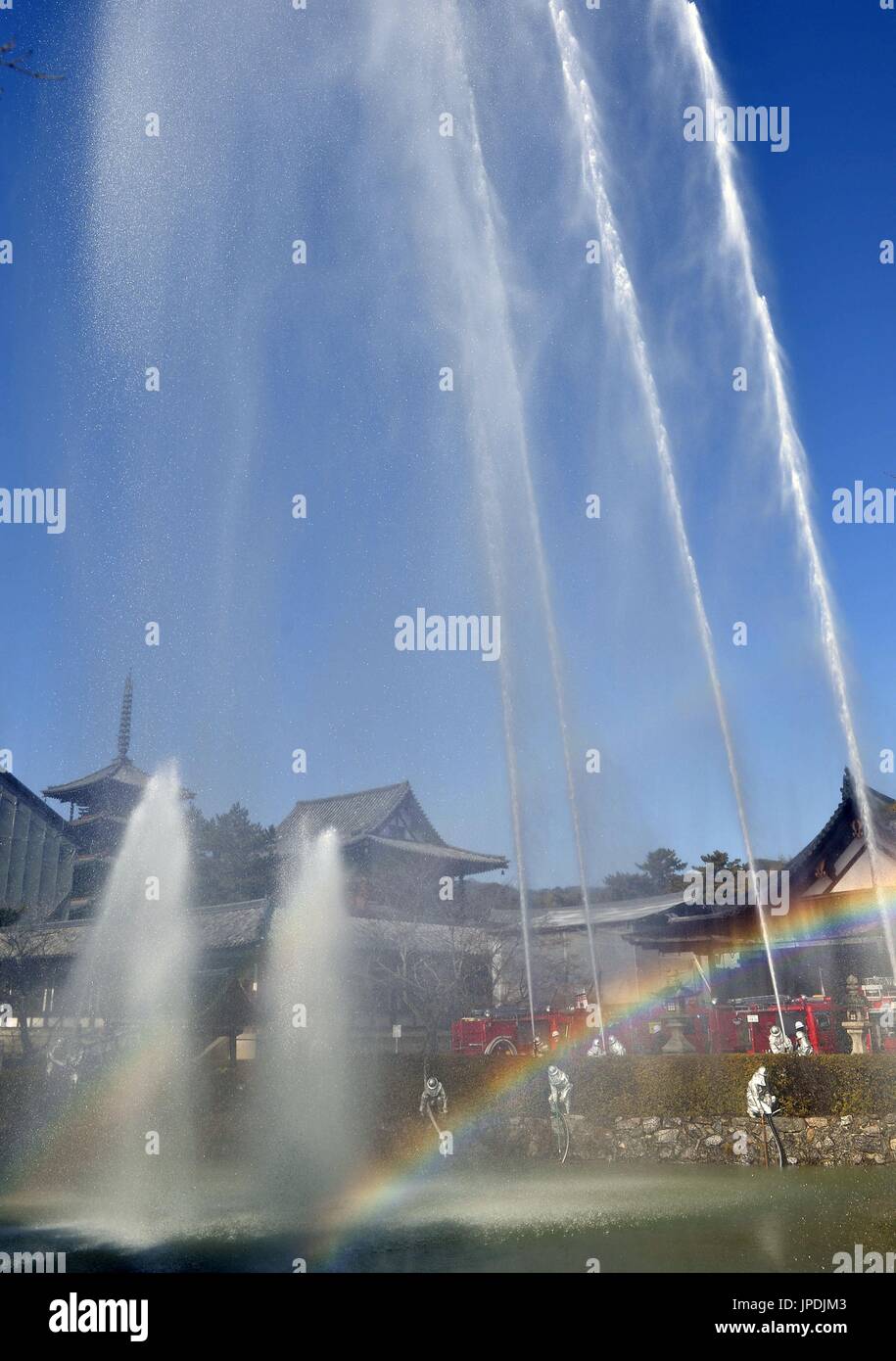 Columns of water are discharged during a fire drill at Horyuji Temple ...