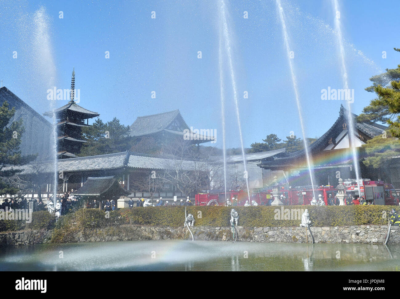 Columns of water are discharged during a fire drill at Horyuji Temple ...
