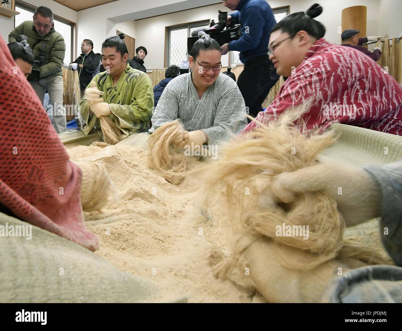 Sumo wrestlers knead hemp with rice bran at the Tagonoura stable in ...