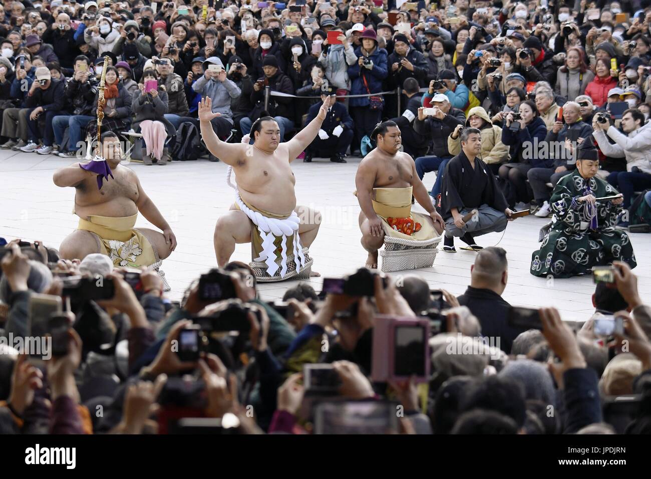 New yokozuna Kisenosato (C) performs his first ring-entry ceremony on ...