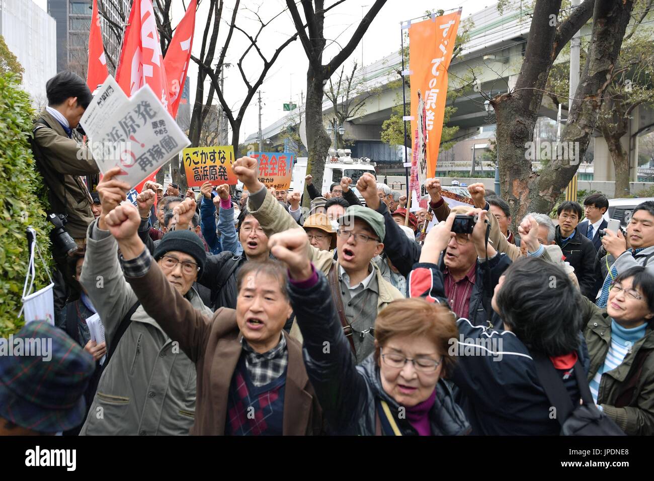 People stage a protest rally on March 28, 2017, in front of the Osaka ...