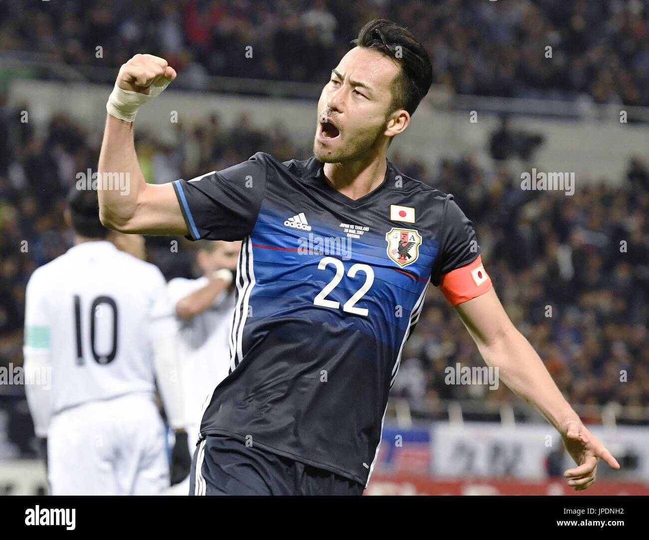 Japan's Maya Yoshida celebrates after heading his side's fourth goal ...