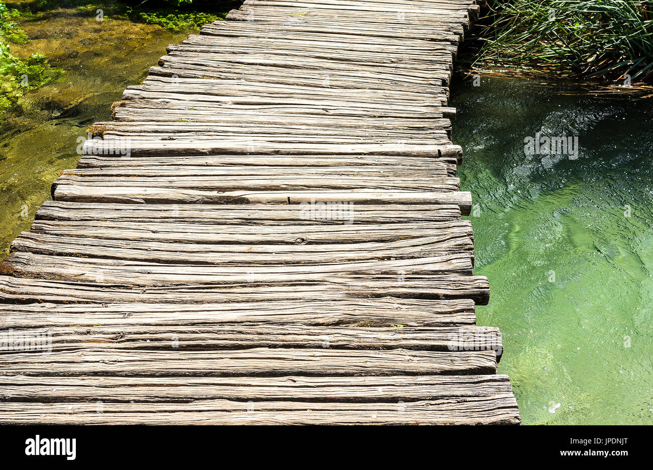 Wooden bridge over the water Stock Photo - Alamy