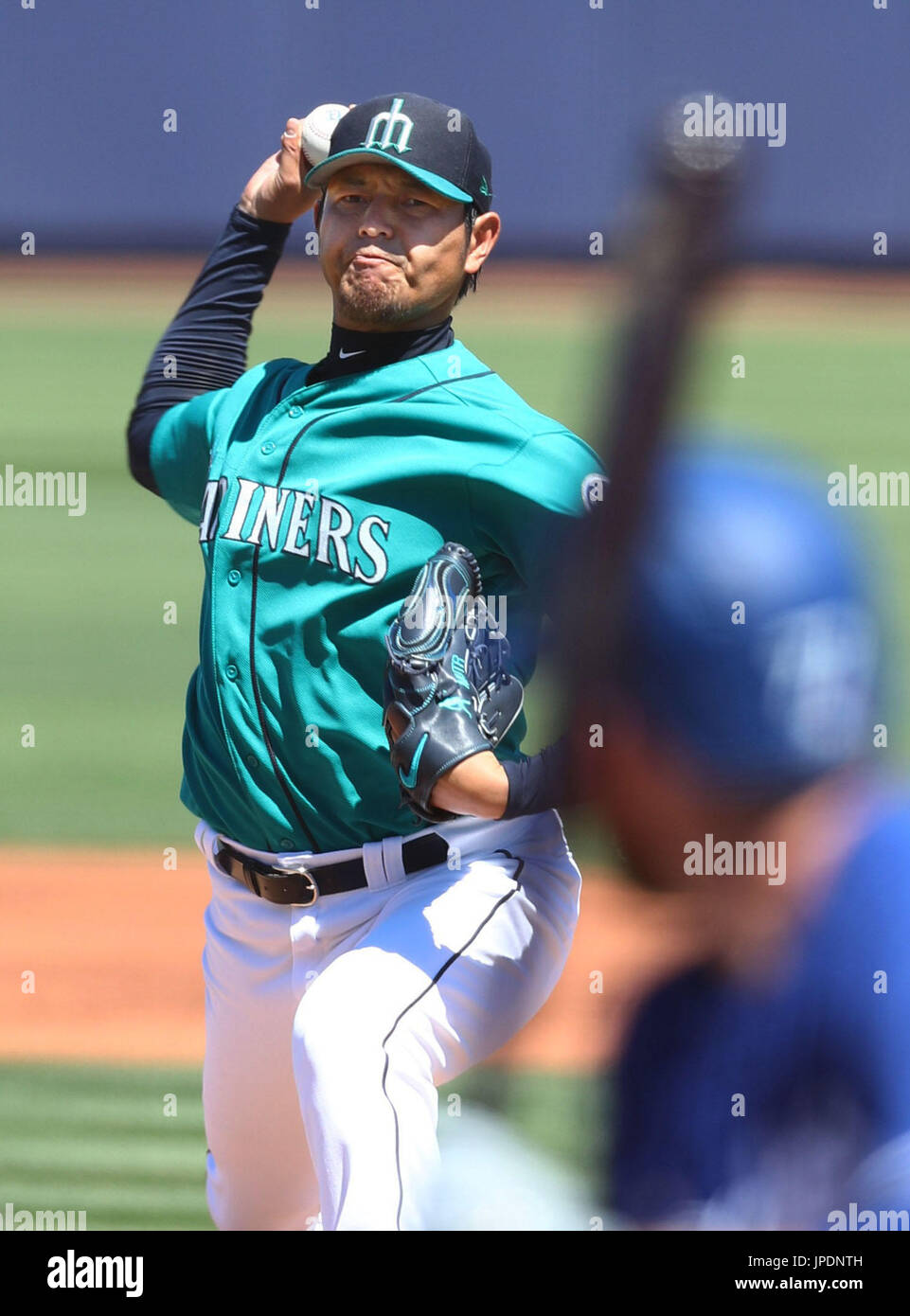 Hisashi Iwakuma of the Seattle Mariners pitches in a spring training ...