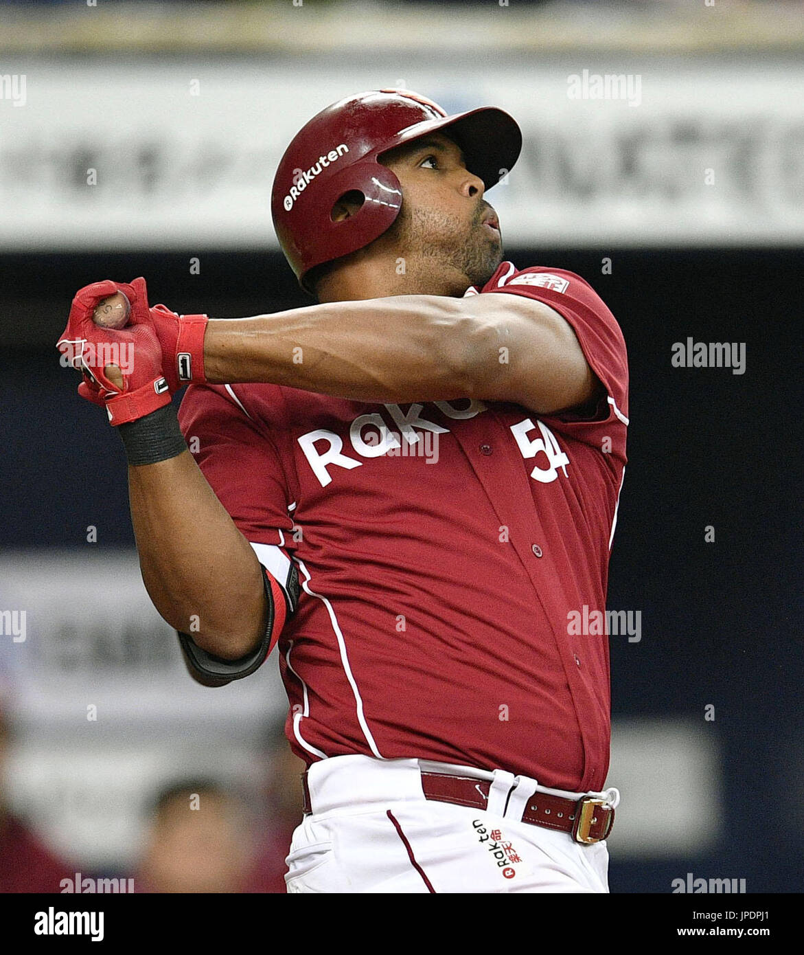 Carlos Peguero of the Rakuten Eagles hits a two-run homer in the ninth ...