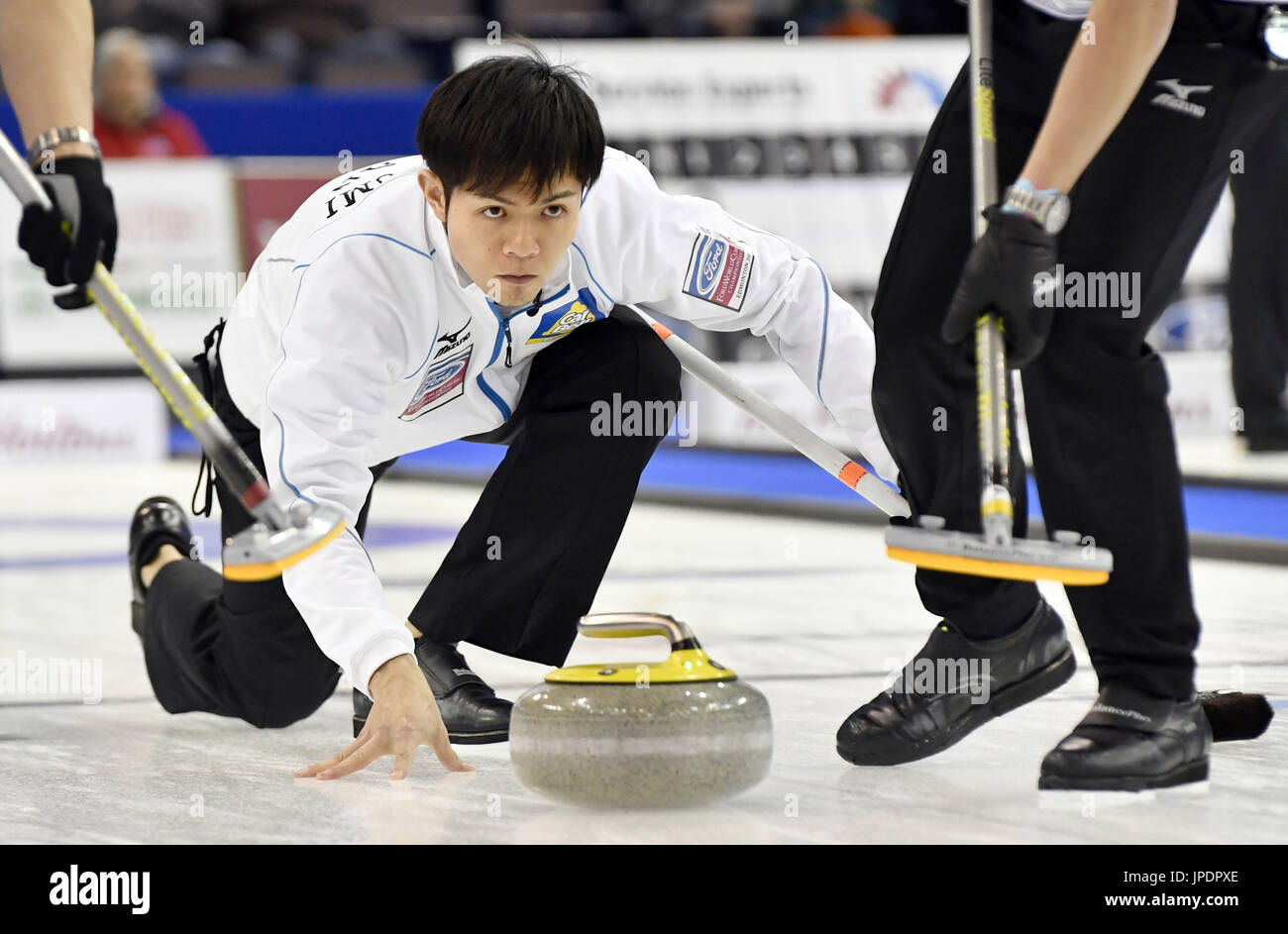 Japan skip Yusuke Morozumi makes a shot during the second end of a men ...