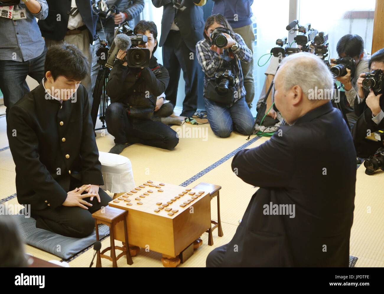 Sota Fujii (L), a 14-year-old professional shogi player, takes on Hifumi Kato, 76, in the Ryuo ...