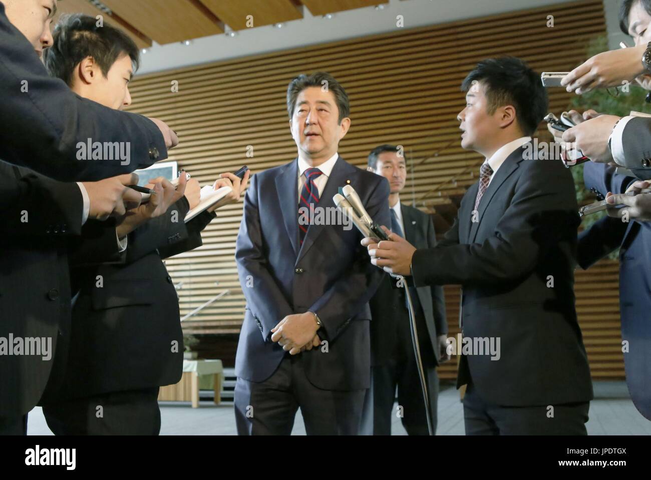 Prime Minister Shinzo Abe meets with reporters at his office in Tokyo ...