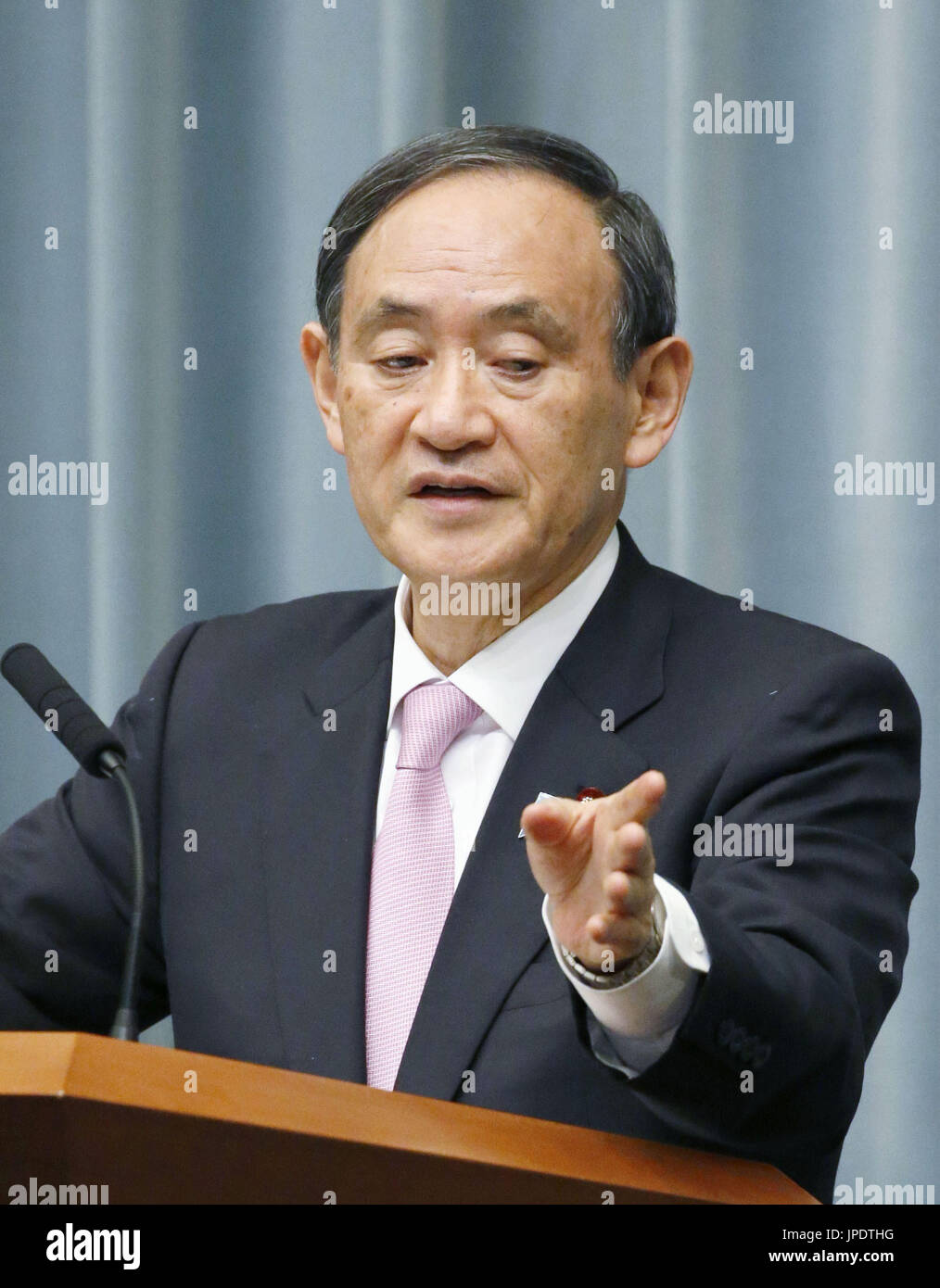 Japanese Chief Cabinet Secretary Yoshihide Suga says at a press ...