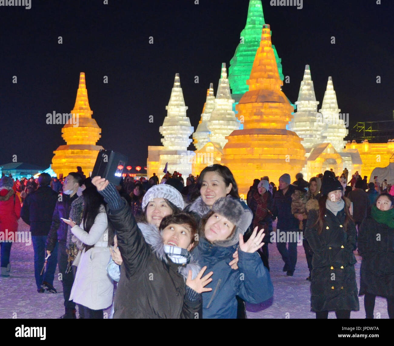 Women take a selfie at the annual snow and ice festival in Harbin, the ...
