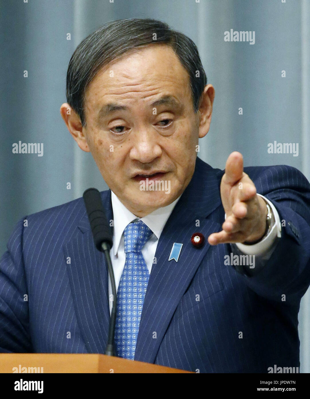 Japanese Chief Cabinet Secretary Yoshihide Suga attends a press ...