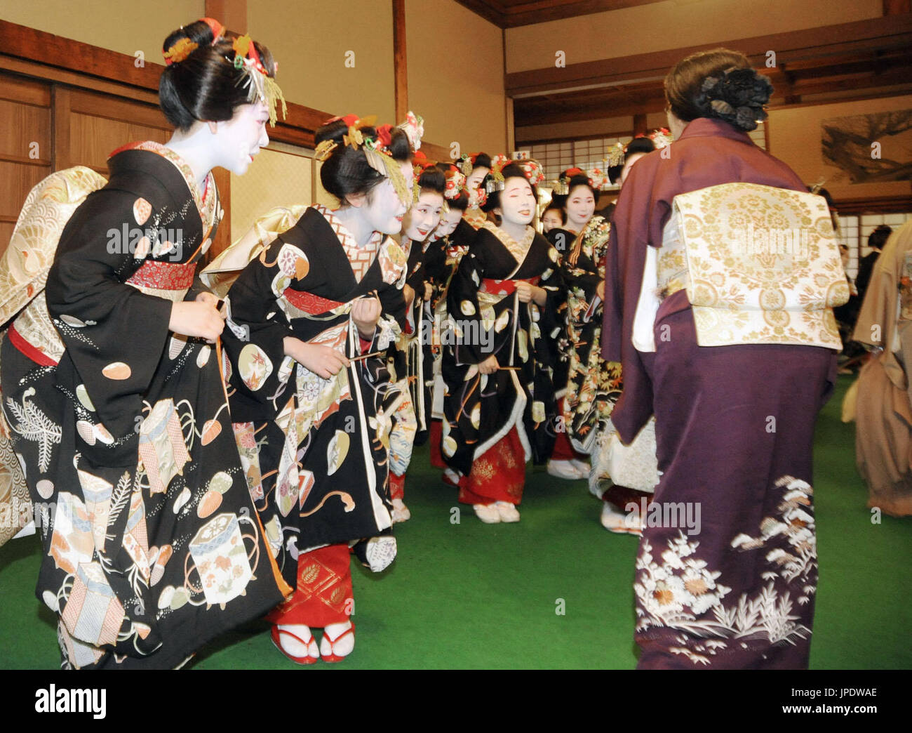 Wearing formal attire, geisha attend a ceremony to mark the first ...