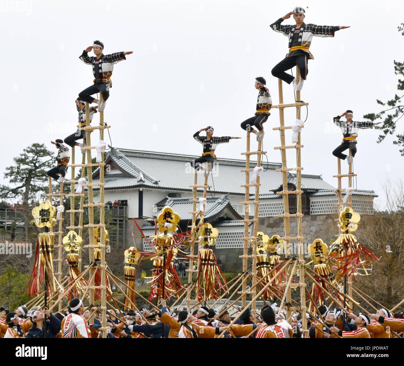 Firefighters perform traditional ladder acrobatics during the annual ...