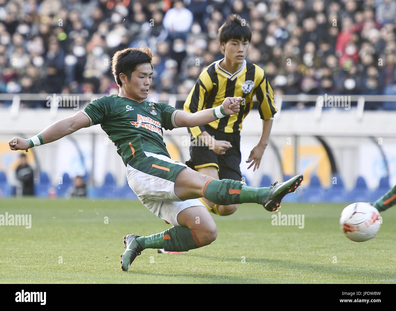 Akito Narumi (front) of Aomori Yamada High School scores a goal against ...