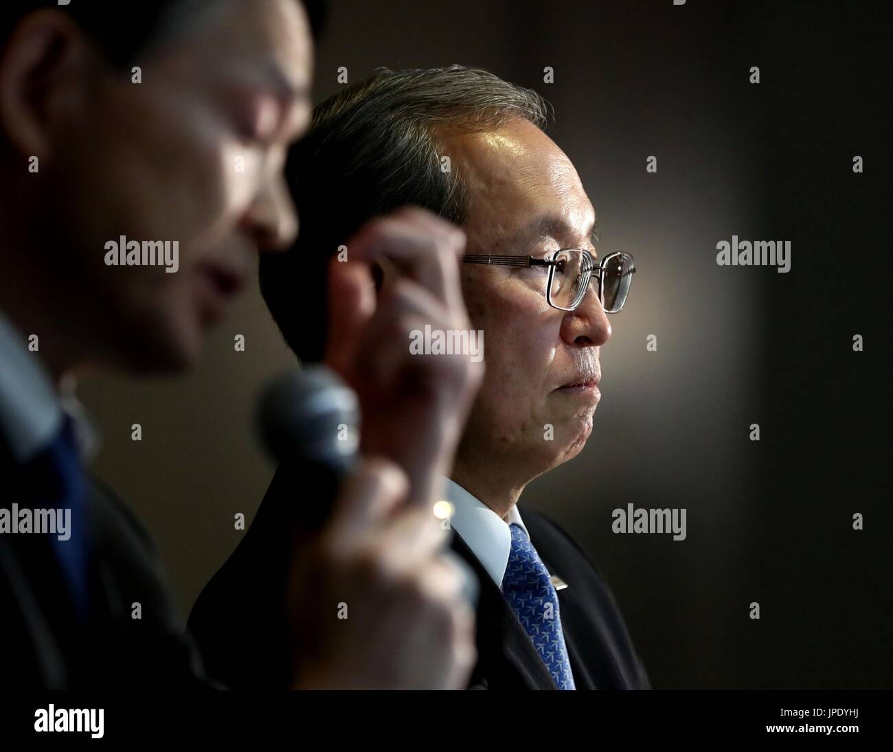 Toshiba Corp. Chief Executive Satoshi Tsunakawa (rear) announces at a ...