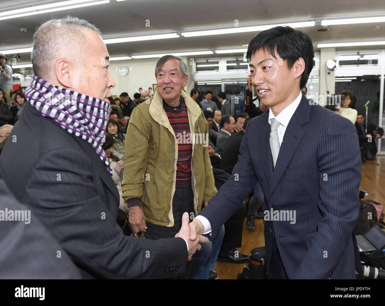 Hiroto Fujii (R), the former mayor of Minokamo in central Japan, who ...