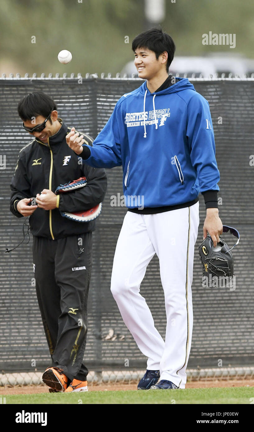 Nippon Ham Fighters two-way player Shohei Otani (R) smiles at the team ...