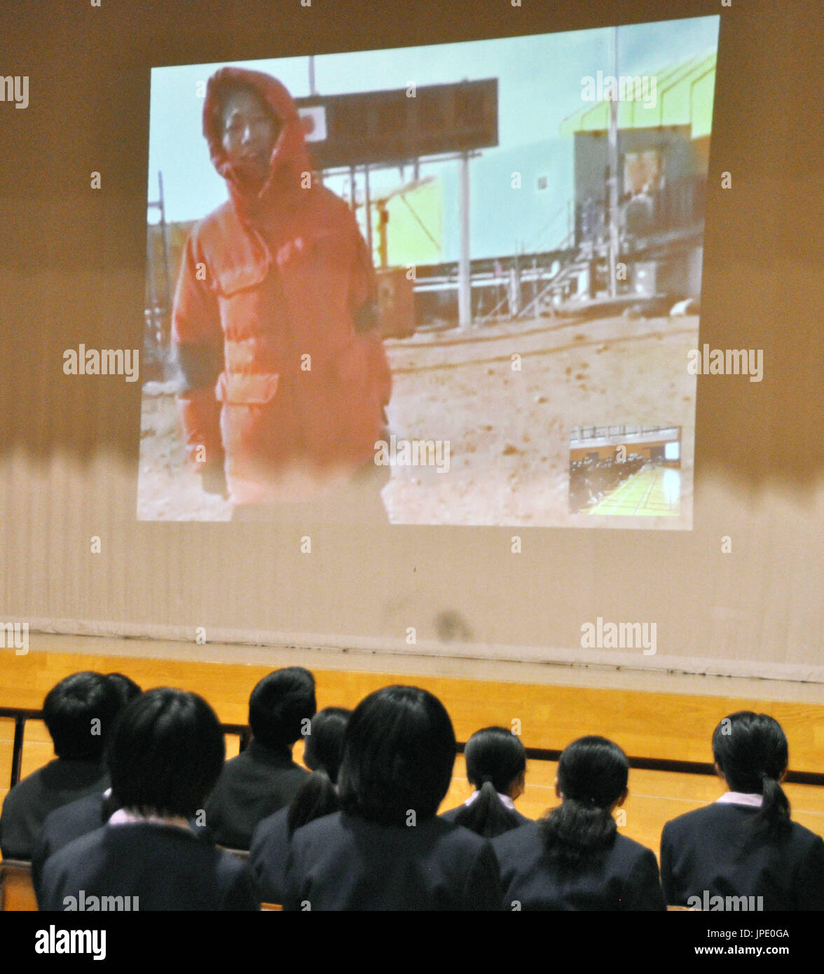 Junior high school students watch a screen during a special class ...