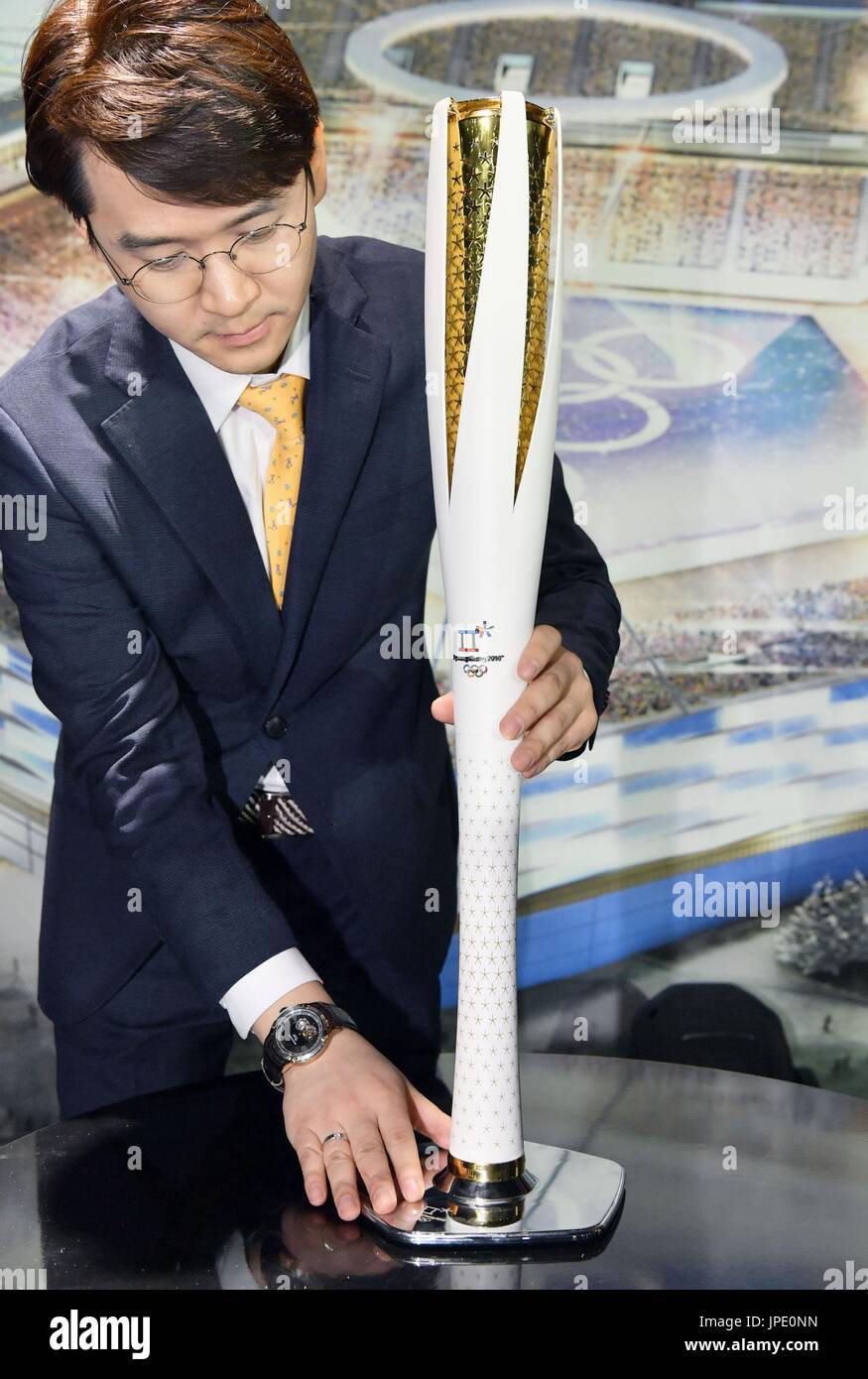 An Olympic torch for the 2018 Pyeongchang Winter Olympics is unveiled ...