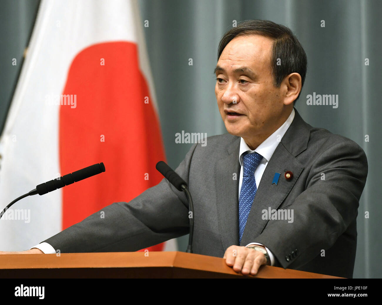 Chief Cabinet Secretary Yoshihide Suga attends a press conference in ...