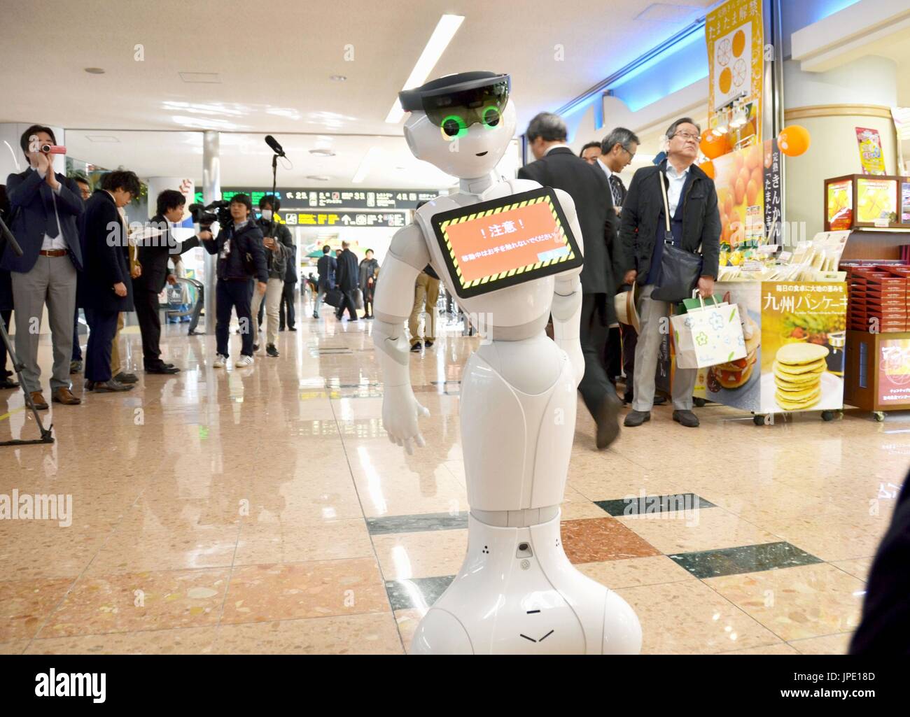 Pepper, a humanoid robot developed by SoftBank Group Corp., wearing ...