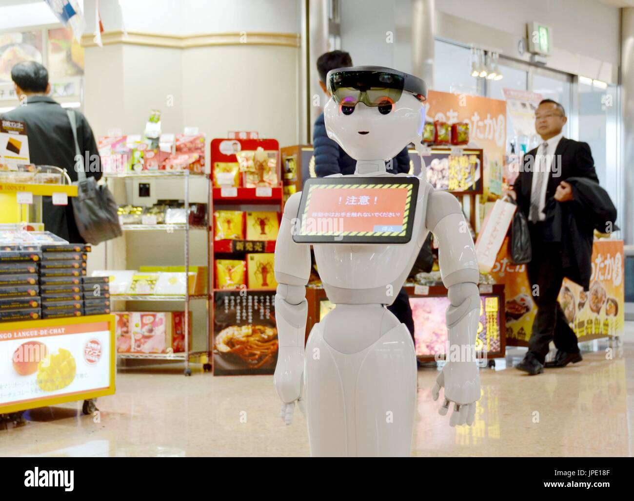 Pepper, a humanoid robot developed by SoftBank Group Corp., wearing ...