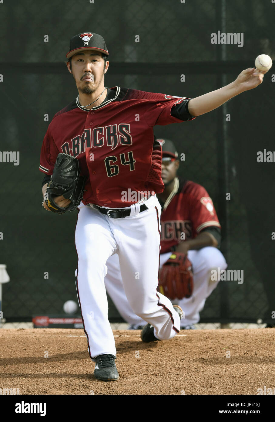 Non-roster Japanese invitee Yuhei Nakaushiro throws a bullpen session ...