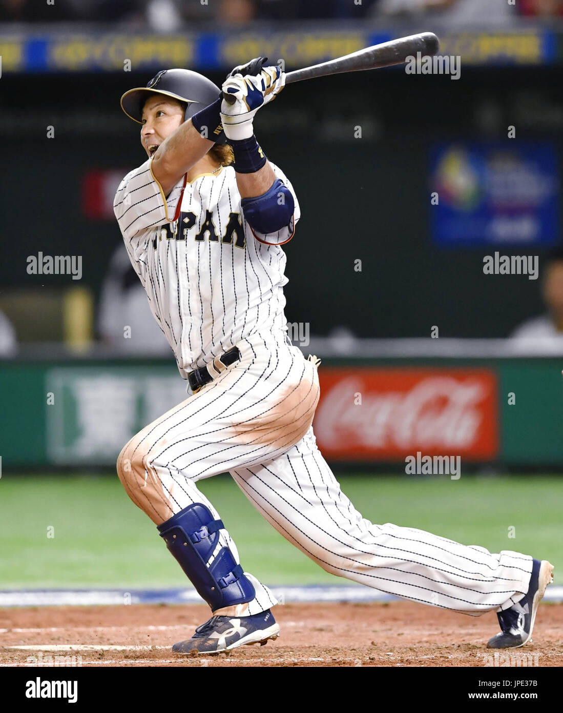 Japan's Nobuhiro Matsuda hits a three-run homer over the left-field ...