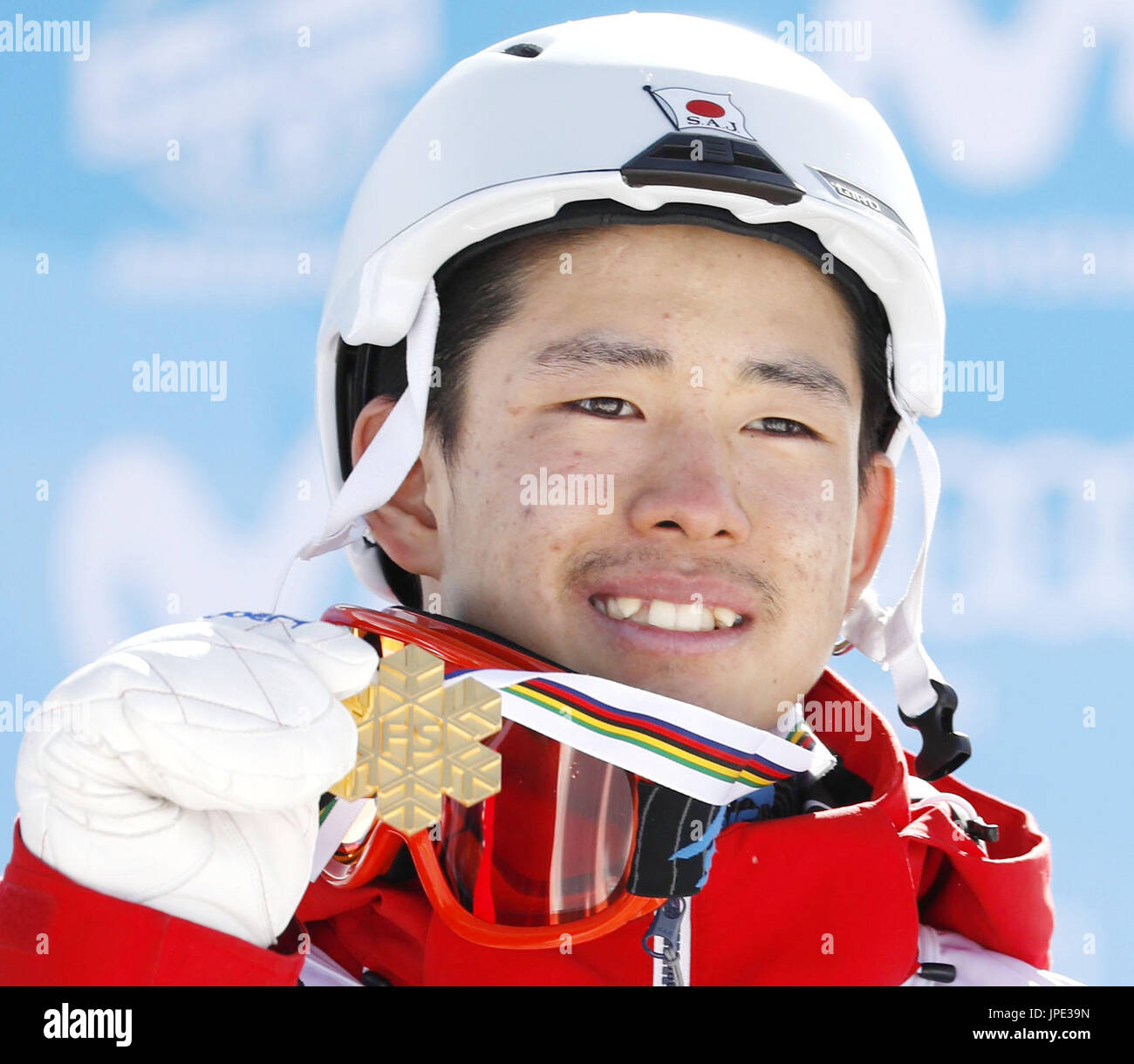 Ikuma Horishima of Japan shows off his gold medal after winning the men ...