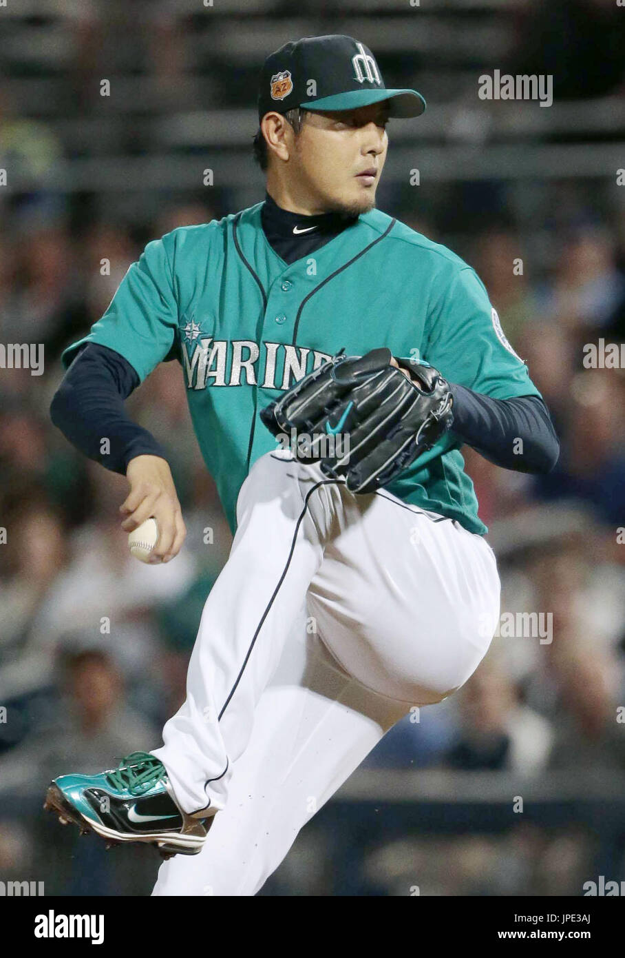 Hisashi Iwakuma of the Seattle Mariners pitches in a spring training ...