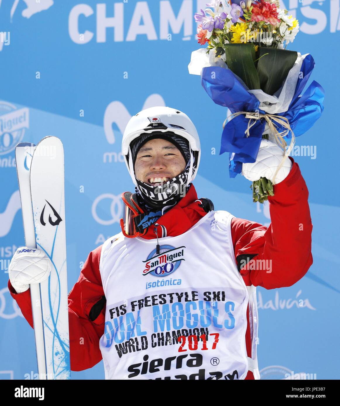 Gold medalist Ikuma Horishima of Japan smiles during an award ceremony ...