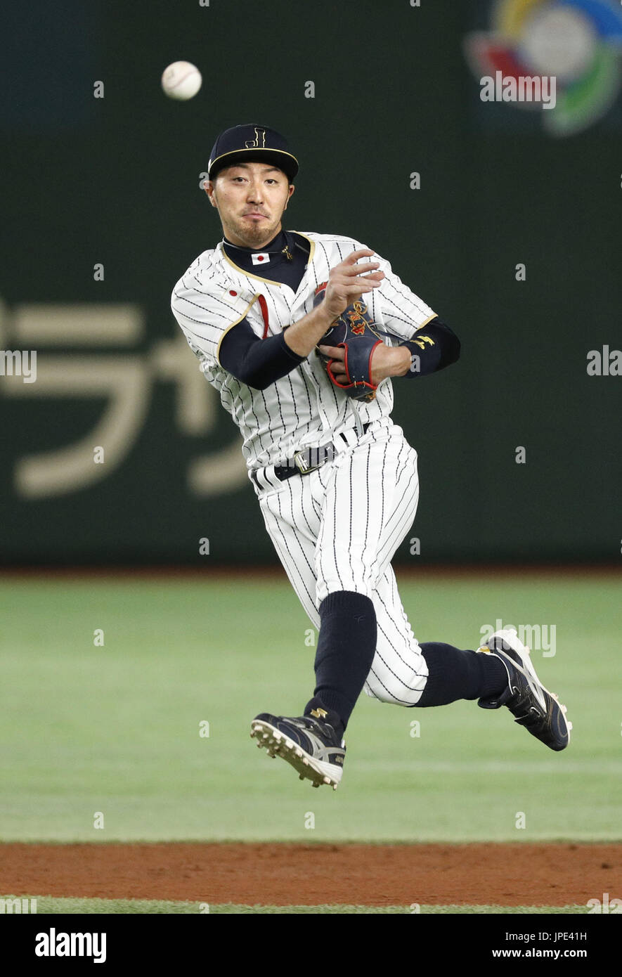 Japanese second baseman Ryosuke Kikuchi throws to first on a grounder in the sixth inning of an ...